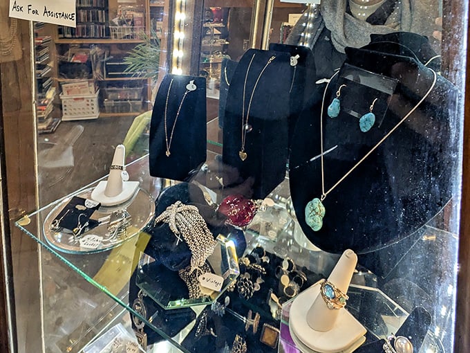 The jewelry case—where someone's relinquished treasures become your new conversation pieces, each with stories you'll never know but can reimagine.