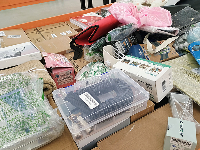 One shopper's retail chaos is another's organized opportunity—each box potentially holding that perfect something you didn't know you needed.