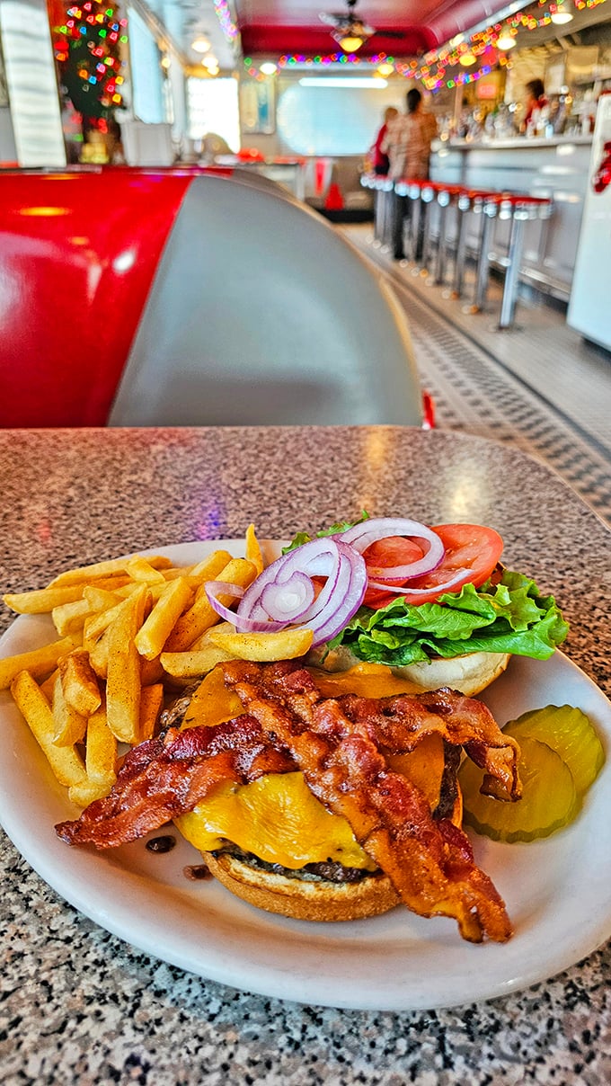 The burger that time forgot—in the best possible way. Crispy bacon and melted cheese create a symphony of flavors worth every napkin.