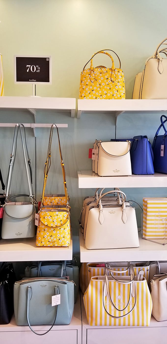 Kate Spade handbags displayed with 70% off tags—the kind of math problem everyone suddenly becomes a genius at solving.