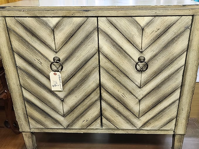 This isn't just a cabinet—it's architectural poetry in wood, with chevron patterns that would make any interior designer swoon.