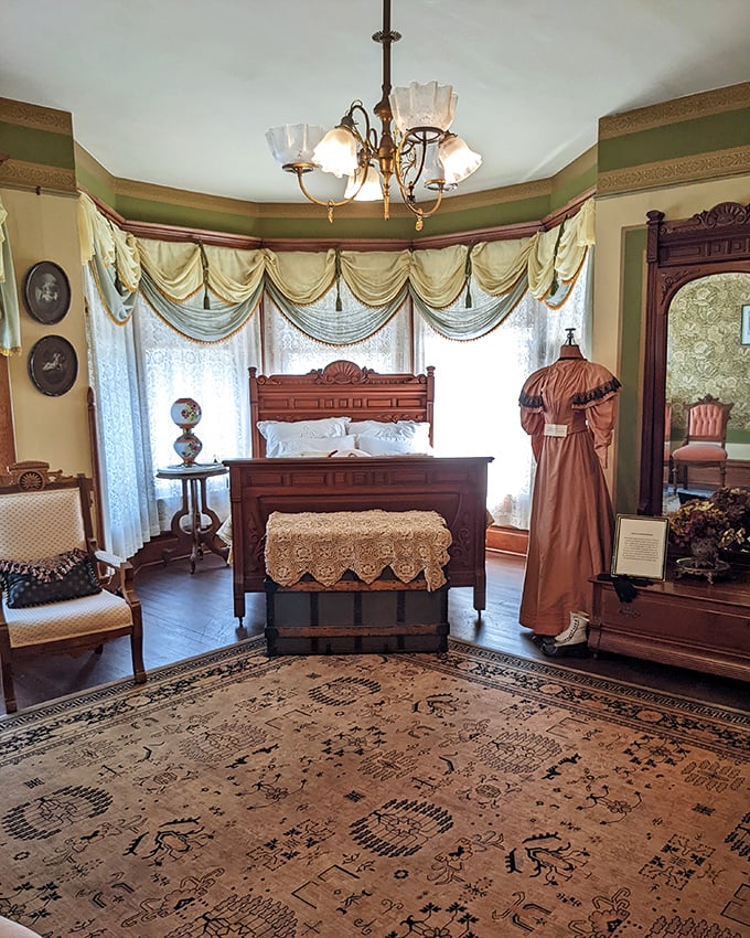 This bedroom isn't just preserved – it's ready for occupancy. That dress stands at attention, waiting for its owner to return from the 1880s any minute now.