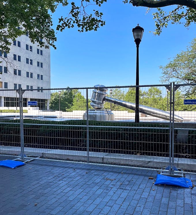 "Sorry, the court is temporarily in recess." Even behind construction fencing, the giant gavel commands attention against the bright blue Ohio sky.