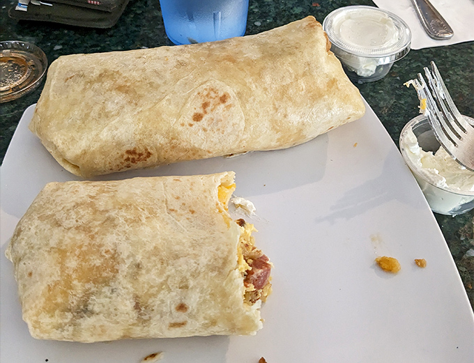 The breakfast burrito in its natural habitat—a tortilla-wrapped miracle that transforms humble ingredients into something worth driving hours to experience.