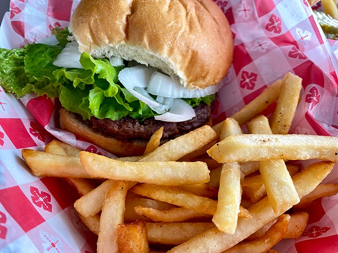 Sometimes you just need a proper burger. This one, with its seasoned fries sidekick, isn't trying to reinvent the wheel—just perfect it.