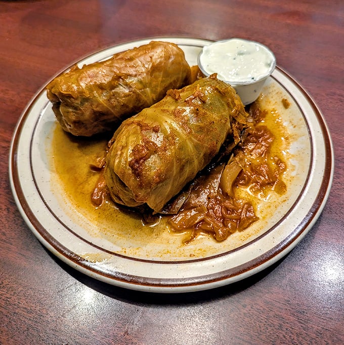 Hungarian cabbage rolls that your grandmother would approve of—if she were Hungarian. The side of sour cream adds that perfect tangy counterpoint to the savory filling.