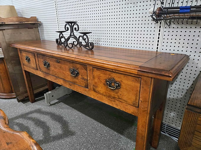 This antique sideboard has probably witnessed more family dinners than your grandmother. Solid craftsmanship that tells stories.
