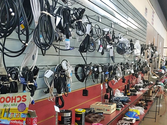 The wall of cables and cords – technological spaghetti that somehow contains exactly the one adapter you've been searching for.