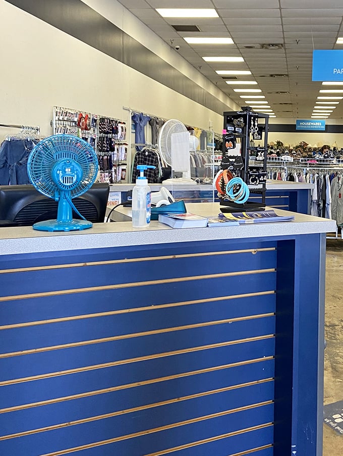 The checkout counter—the final frontier between you and victory, where that blue fan might be cooling off the day's hottest deals.