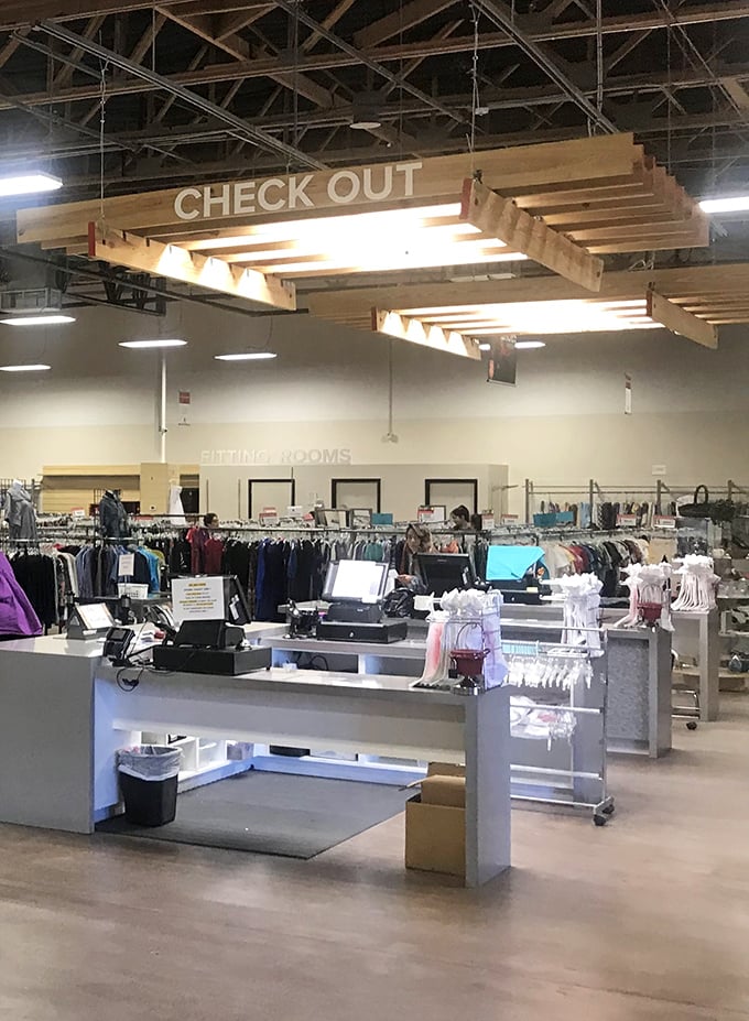 The checkout area—where thrifting dreams are tallied and that $35 cart special transforms your haul into legitimate bargains.