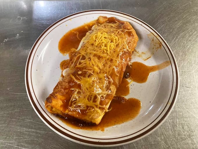This enchilada isn't trying to win beauty contests—it's too busy delivering the kind of cheesy, saucy satisfaction that fancy restaurants often miss.
