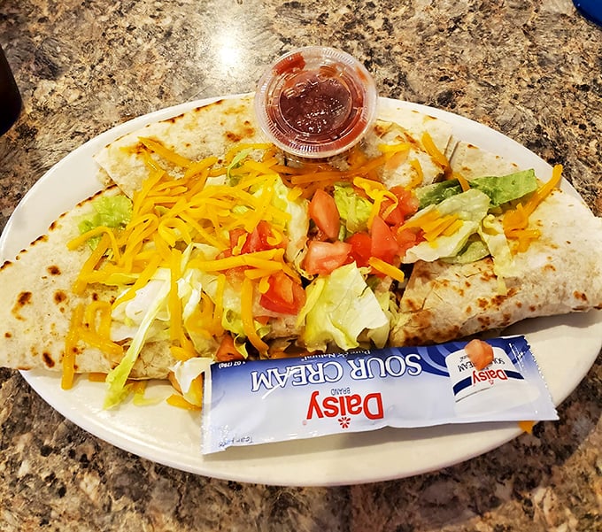 This quesadilla doesn't just have cheese—it has an entire dairy farm's worth, plus enough fresh veggies to count as a salad. Almost.
