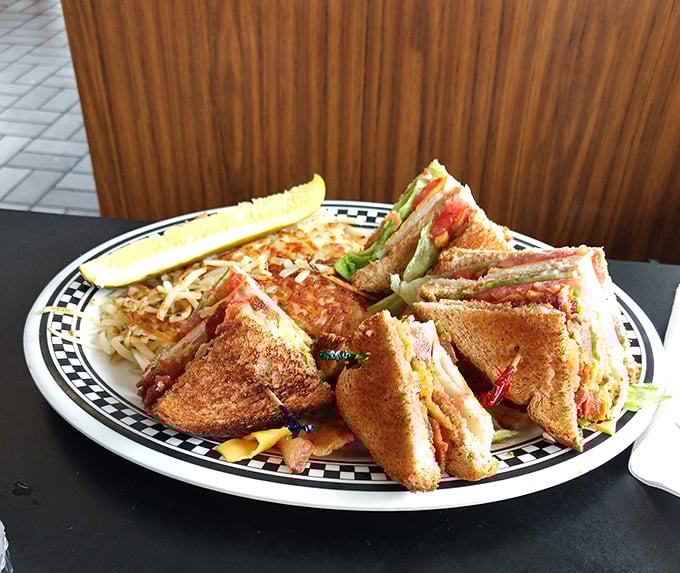 The legendary club sandwich—architectural marvel of toast, meat, and vegetables that somehow tastes even better than it looks. Worth the drive from anywhere.