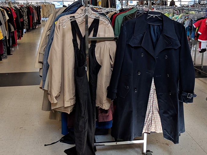 The coat rack reads like a fashion history book—classic trenches and practical parkas hanging shoulder to shoulder in a democracy of style.
