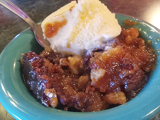 This cobbler isn't just dessert—it's a warm hug in a bowl, topped with ice cream that's melting with excitement to meet its fruity companion.