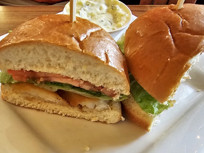 Fresh cod nestled in a pillowy bun with crisp lettuce—a sandwich that makes you wonder why you'd ever eat anything else.