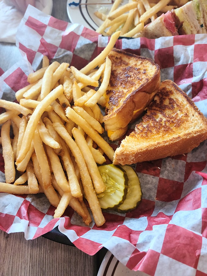 The grilled cheese and fries arrive in their red checkered paper boat, sailing straight into your comfort food dreams.