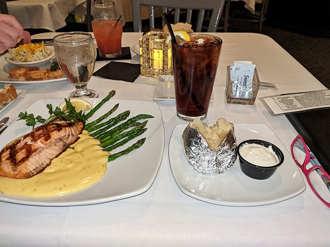 Fish, asparagus, and a loaded baked potato—the holy trinity of supper club dining. Add a cold drink and you've found heaven on a plate.