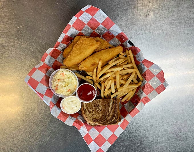 Comfort food served on a red-checkered paper – this fish basket with fries and coleslaw is the lunch equivalent of a warm hug.