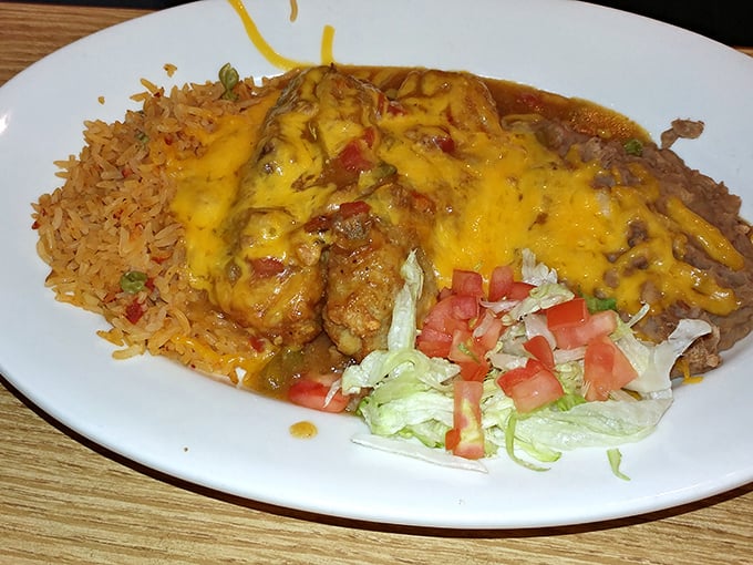 A Mexican-inspired dish smothered in cheese with Spanish rice and fresh vegetables—proof that Mickey's culinary talents extend beyond beef.