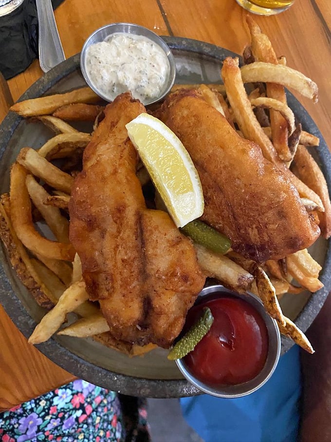 The fish and chips that launched a thousand return visits. Crispy, golden batter protecting tender white fish alongside hand-cut fries—the holy grail of comfort food.
