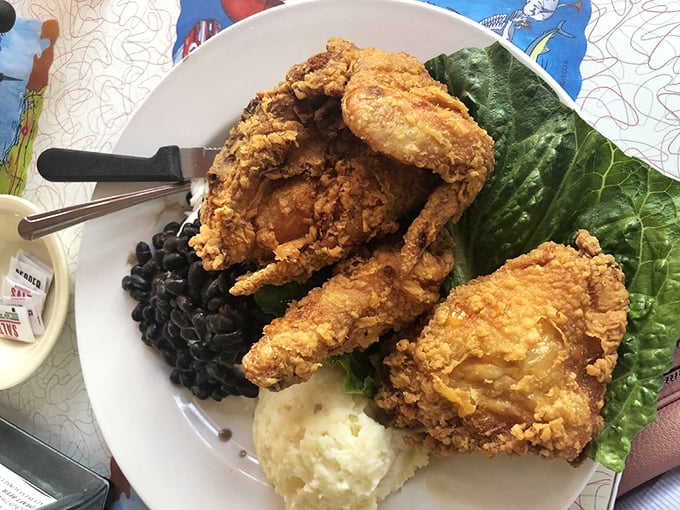 Fried chicken so perfectly golden it deserves its own trophy, served with sides that understand their supporting role in this crispy drama.