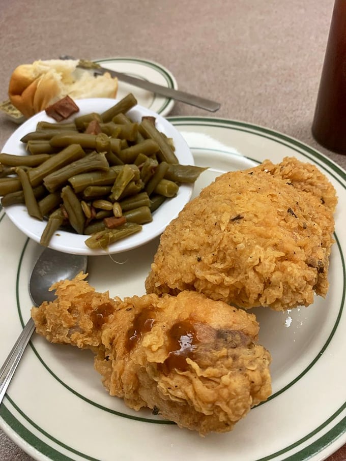 Fried chicken with that golden-ratio crust—audibly crunchy on the outside, miraculously juicy within. The green beans are just playing defense.