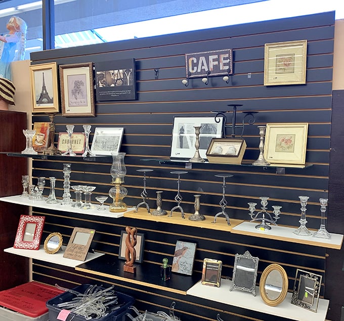 A wall of memories disguised as home décor—each frame and candle holder comes with its own mysterious backstory.
