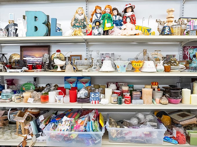 Home décor heaven: where vintage dolls, decorative letters, and candles create the perfect "I meant to do that" eclectic style.