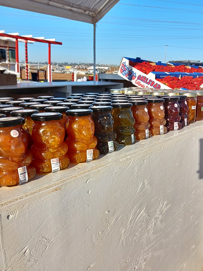 Mason jars of liquid sunshine line the counter—homemade preserves that capture summer's essence for those dreary February mornings.