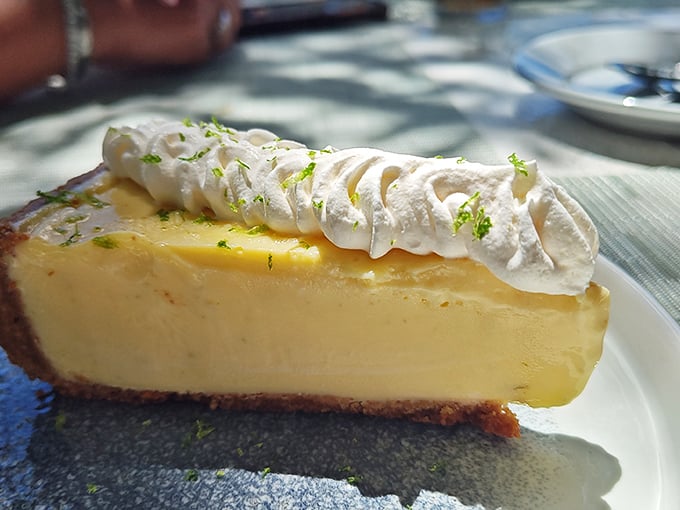 The key lime pie that launched a thousand road trips—tangy, creamy perfection crowned with whipped cream and a hint of lime zest.