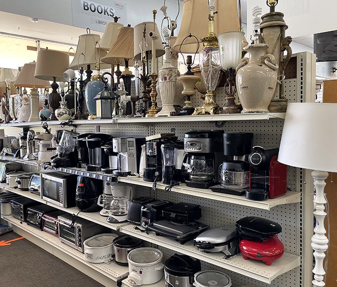 The small appliance graveyard where coffee makers get their second chance at brewing greatness alongside lamps that have seen better—and darker—days.