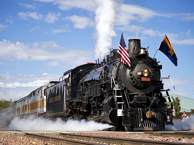 Old Number 4960 announces its arrival with steam and whistles. Those American and Arizona flags aren't just decoration—they're this iron horse's proud battle standards.