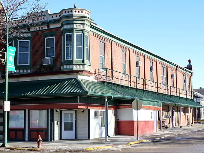 The Dingler Block building anchors downtown with its distinctive green-trimmed bay windows—architectural eye candy that speaks to Emmetsburg's preserved character.
