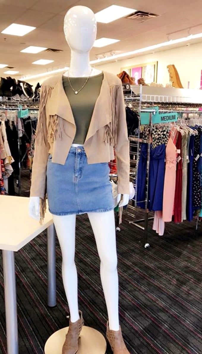 This mannequin outfit could walk straight off a boutique floor – the fringe jacket and denim skirt combo screams "Mississippi cool with big city style."