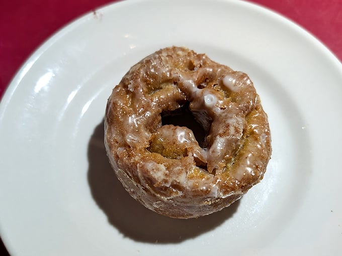 The glazed donut in its natural habitat—simple, unadorned perfection that needs no introduction or fancy accessories.