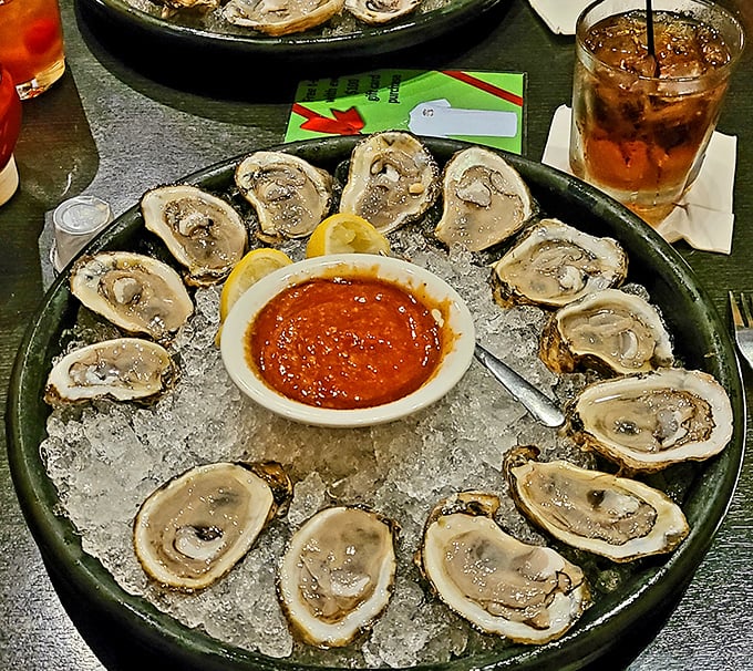 Raw oysters on the half shell – nature's perfect appetizer. Just a squeeze of lemon, a dash of hot sauce, and suddenly Tuesday feels like your birthday.