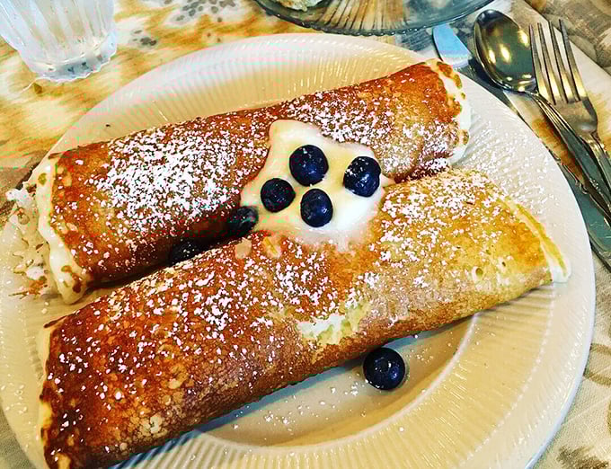 Crepes filled with blueberries and dusted with powdered sugar – like little breakfast presents waiting to be unwrapped by your fork.