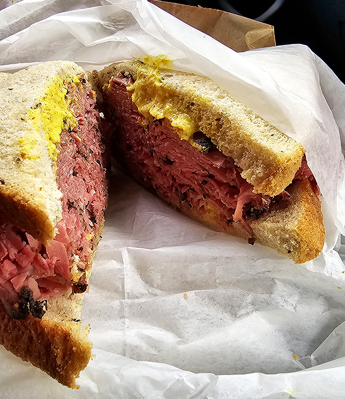 The pastrami mountain – where peppery, smoky beef is piled so high you'll need a strategy session before attempting that first bite.