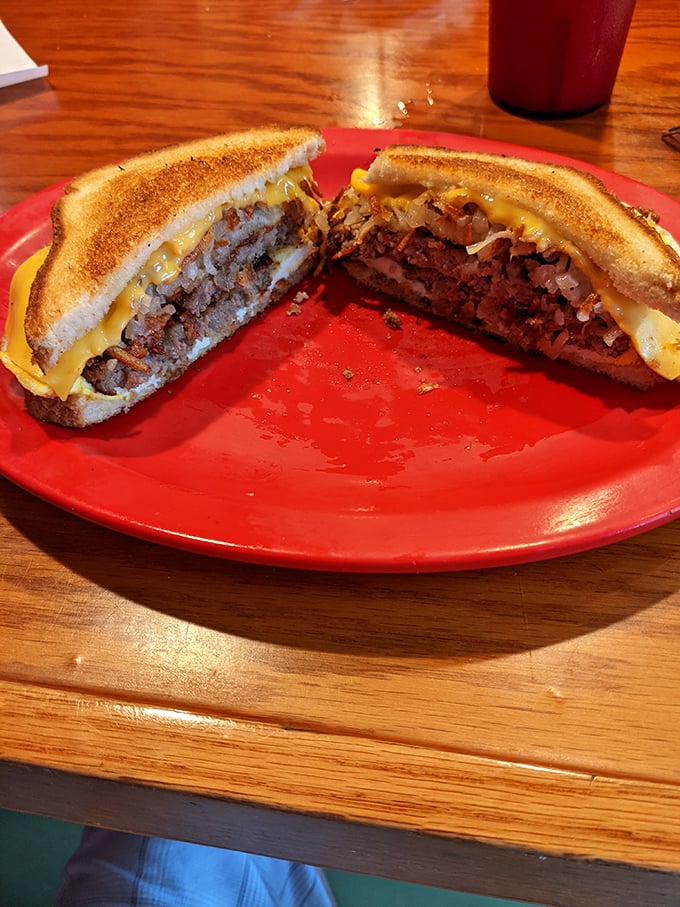 This patty melt isn't messing around—perfectly grilled bread hugging a juicy patty and melted cheese in a sandwich romance for the ages.