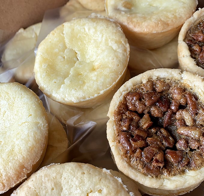 Tiny pecan tarts with big flavor ambitions. Half shortbread cookie, half pecan pie, all delicious – mathematics never tasted so good.