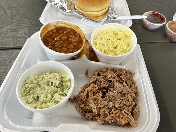 The pulled pork platter – a holy trinity of meat, slaw, and beans that makes you wonder why you'd ever eat anything else.