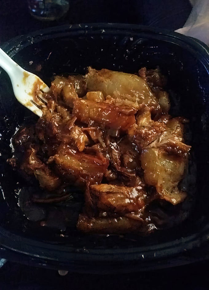 These rib tips swimming in sauce aren't just food—they're a sticky, sweet, savory reminder of why napkins were invented in the first place.