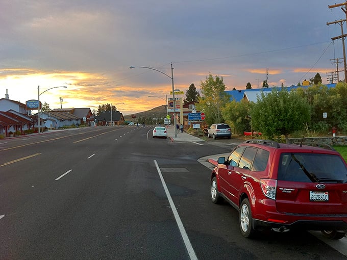 Sunset paints Lee Vining's main drag in cinematic hues – small town America with a blockbuster backdrop.