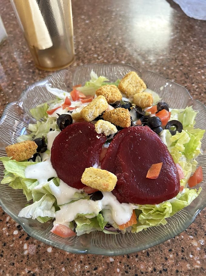 Even the salad at Ray's has personality – beets and croutons playing supporting roles in this fresh intermission between burger acts.