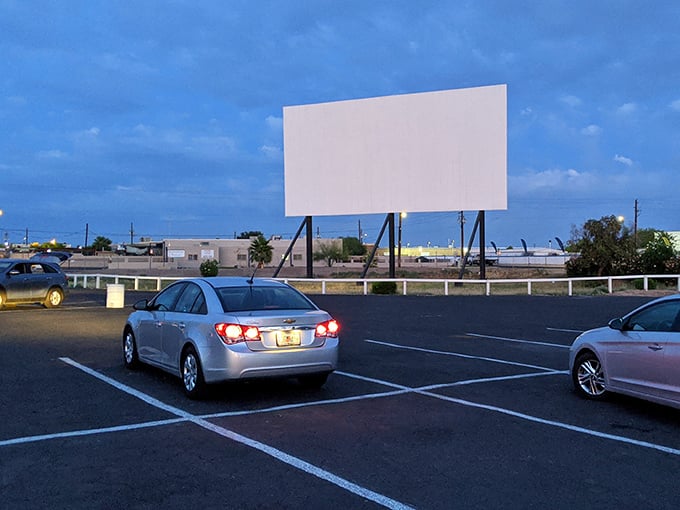 That massive screen rises like a monument to movie nights, ready to light up the desert darkness.