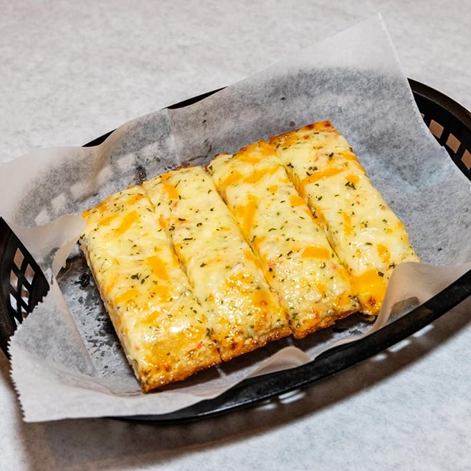 Cheesy garlic bread that's been upgraded to first class—the perfect absorbent companion for soaking up those precious seafood sauces.
