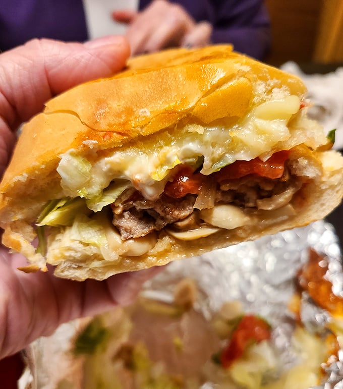 The steak sub isn't just a sandwich – it's a handheld festival of meat, veggies, and melted cheese worth every napkin.