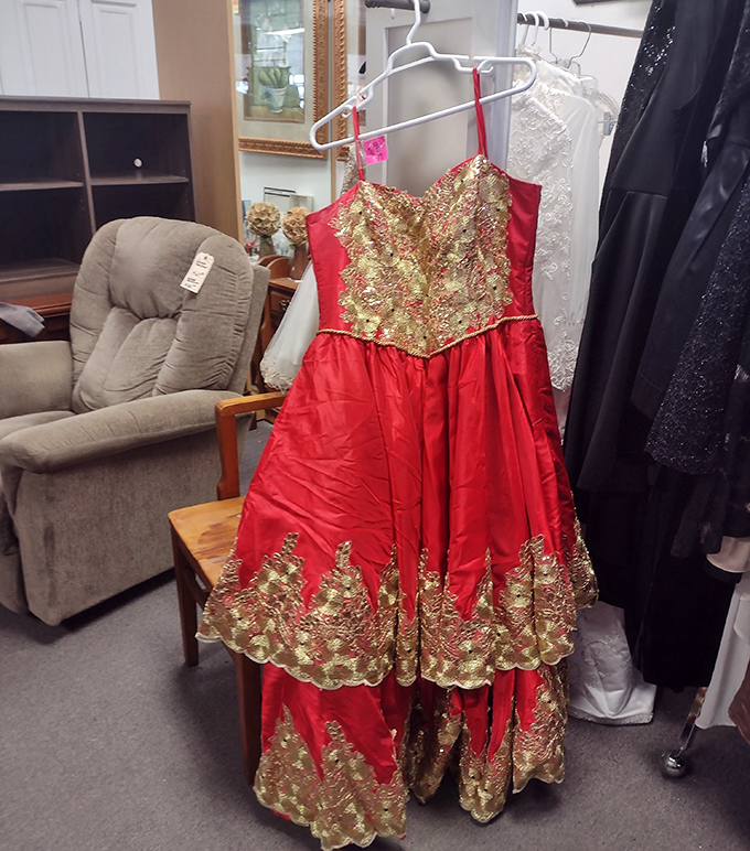 That red and gold gown isn't just formal wear—it's someone's prom night, quinceañera, or wedding reception waiting to dance again at a fraction of retail.