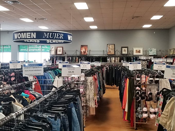 The women's section stretches toward the horizon like a fashion frontier. Those price signs aren't typos—they're invitations to reinvent your wardrobe.